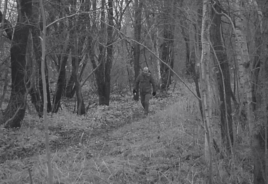 Men creeping around in the rain - The Tree Spy