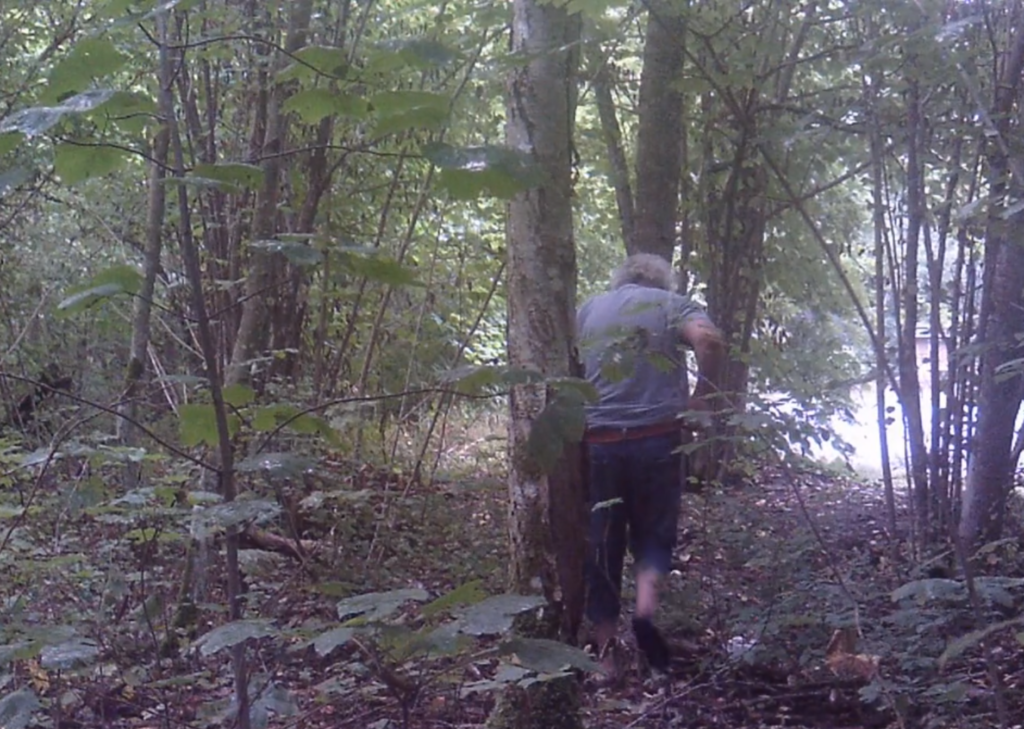 A dump and men in the woods - The Tree Spy